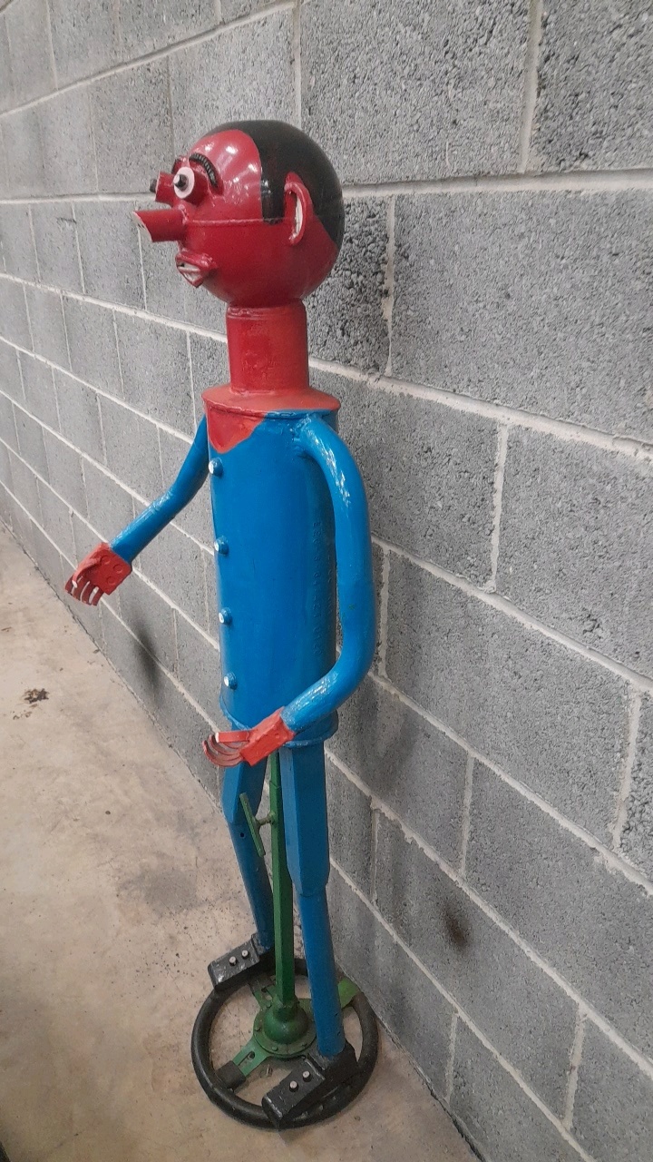 Lot 563 - EXHAUST/ CAR PARTS MAN STATUE