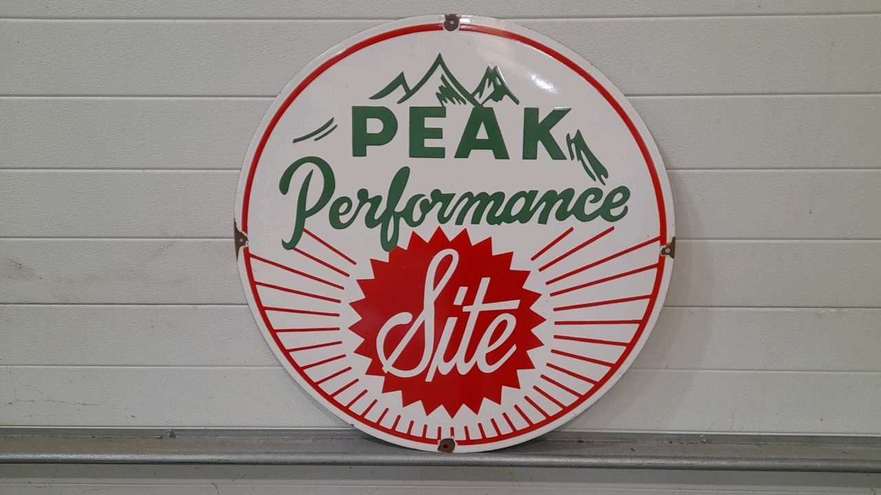 Lot 304 - PEAK PERFORMANCE SITE ENAMEL SIGN 30" DIA