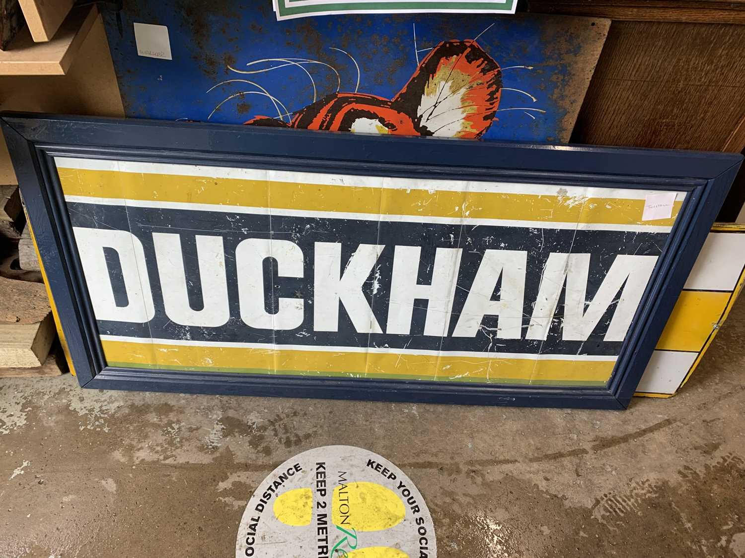 Lot 221 - DUCKHAMS TIN SIGN ON WOOD BOARD