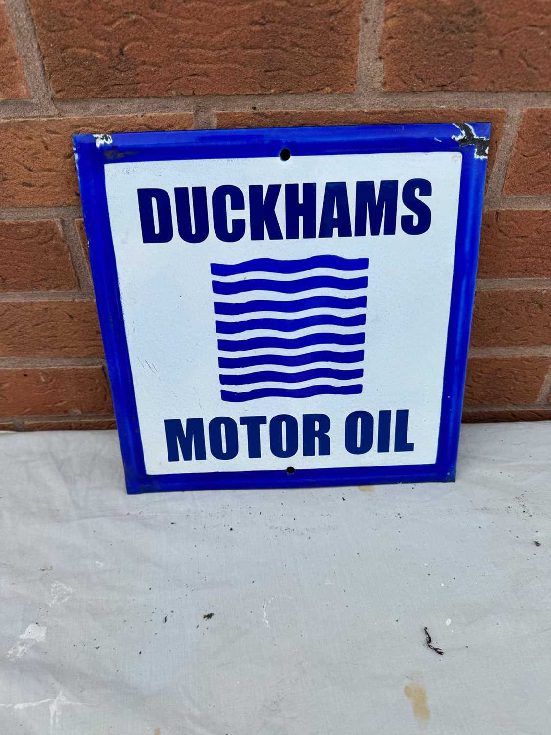 Lot 496 - DUCKHAMS MOTOR OIL ENAMEL SIGN 12" x 12"