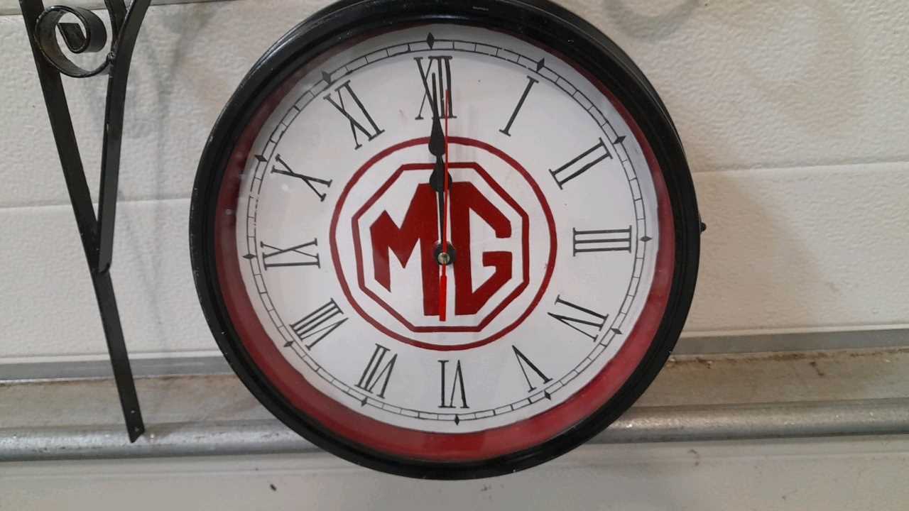 Lot 499 - MG WALL MOUNTED CLOCK , DOUBLE SIDED