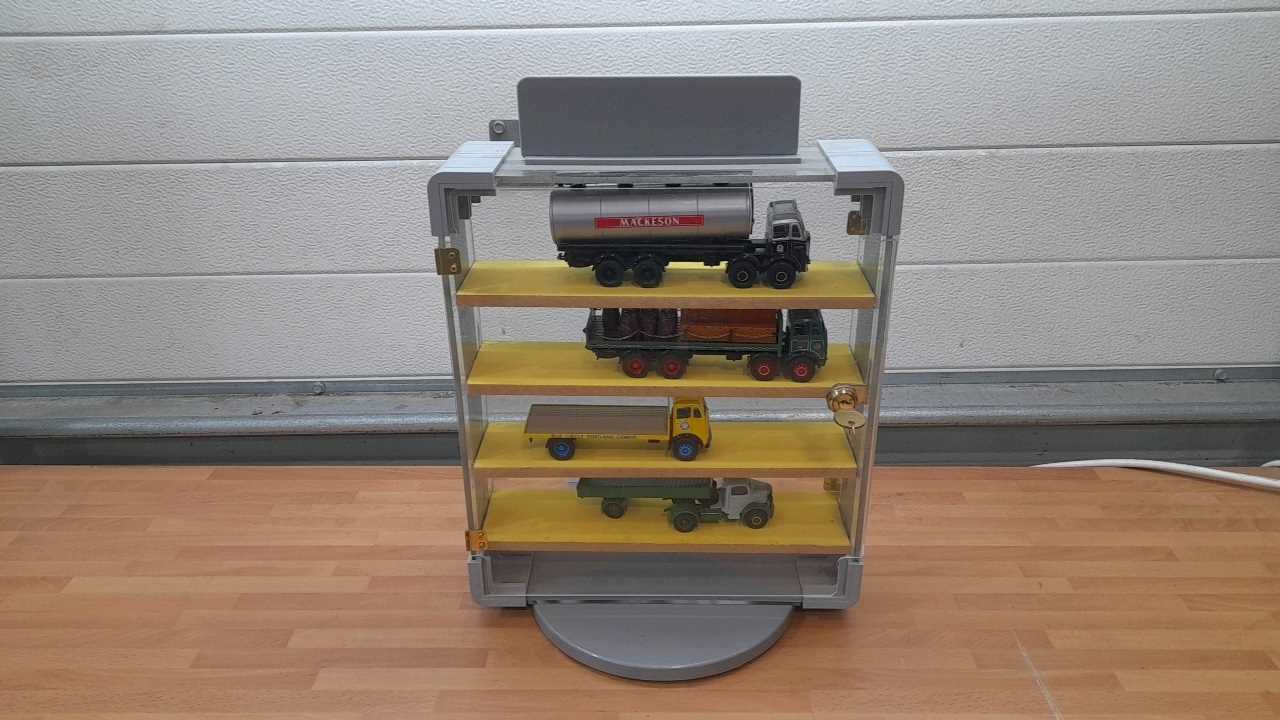 Lot 553 - 4 X CORGI TRUCKS IN REVOLVING DISPLAY STAND