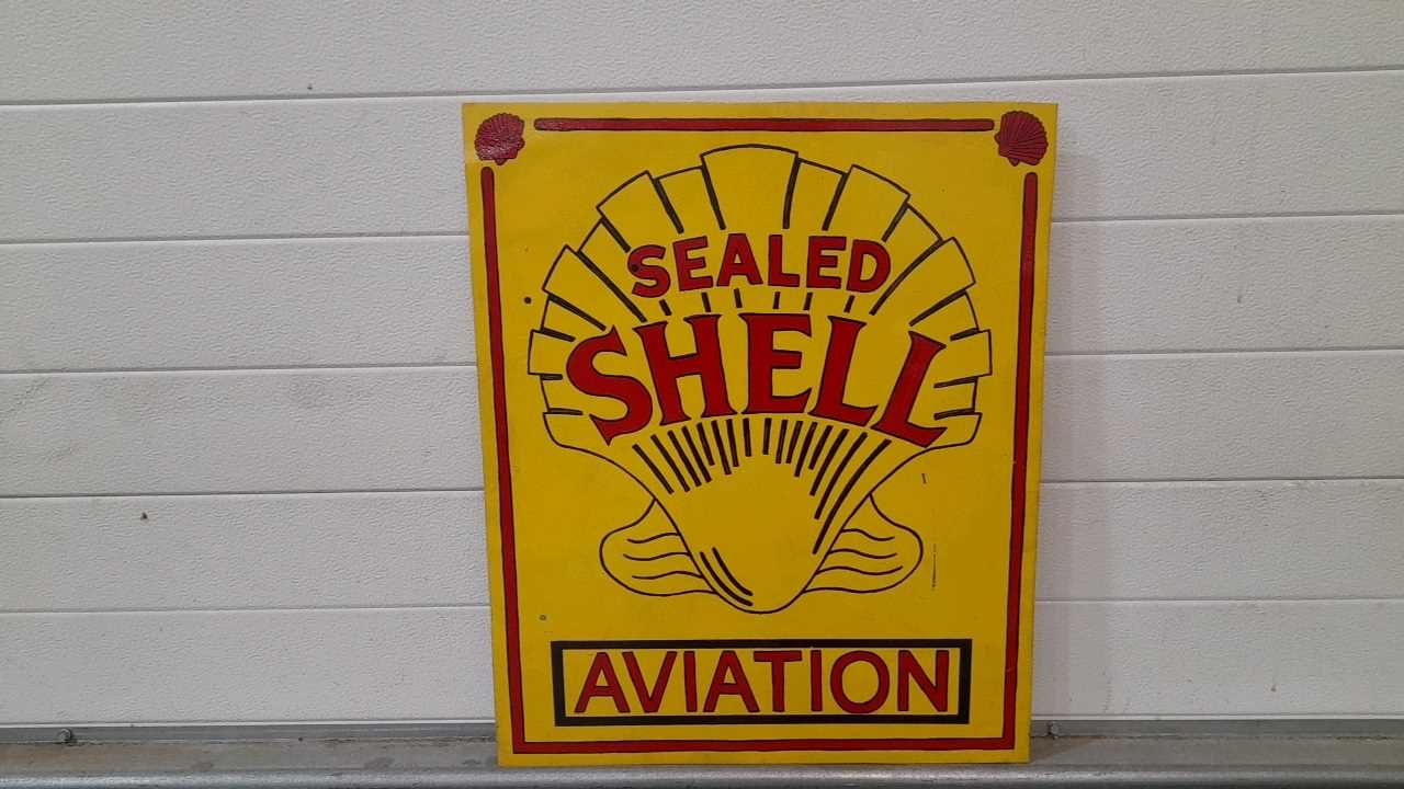 Lot 715 - HAND PAINTED SHELL AVIATION SIGN ON METAL 24"