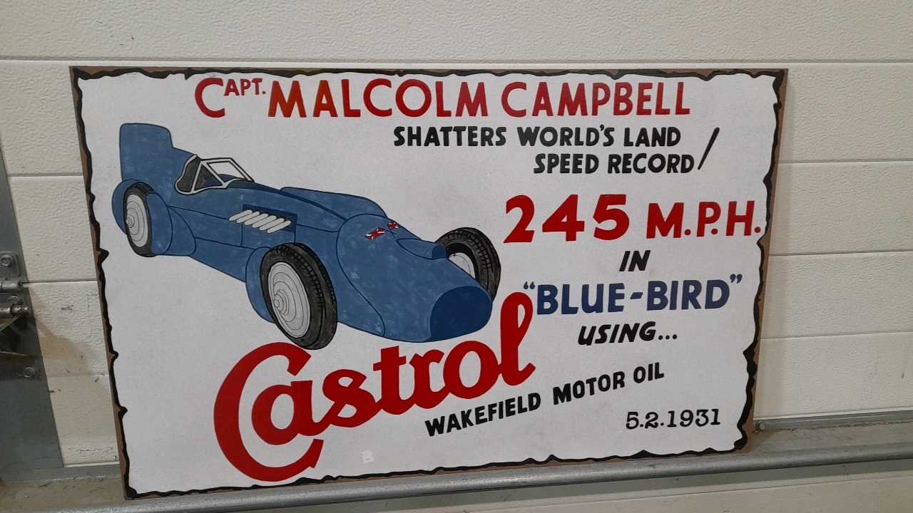 Lot 411 - WOODEN HAND PAINTED MALCOLM CAMPBELL SIGN 32"