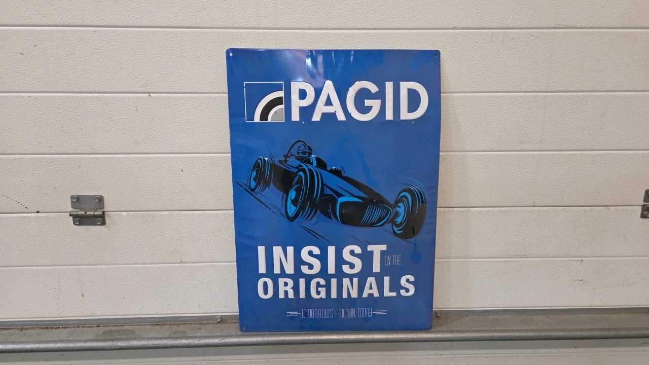 Lot 605 - PAGID INSIST ORIGINALS TIN SIGN 24" x 16"