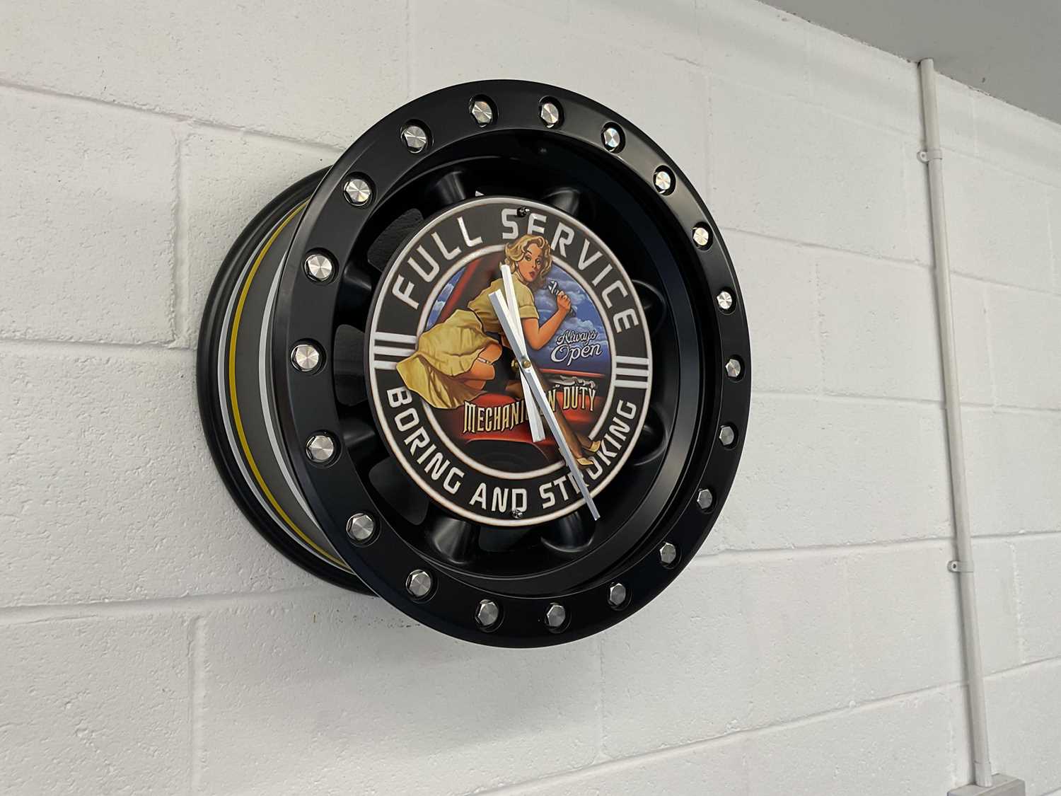 Lot 668 - PIN UP GIRL ALLOY WHEEL CLOCK
