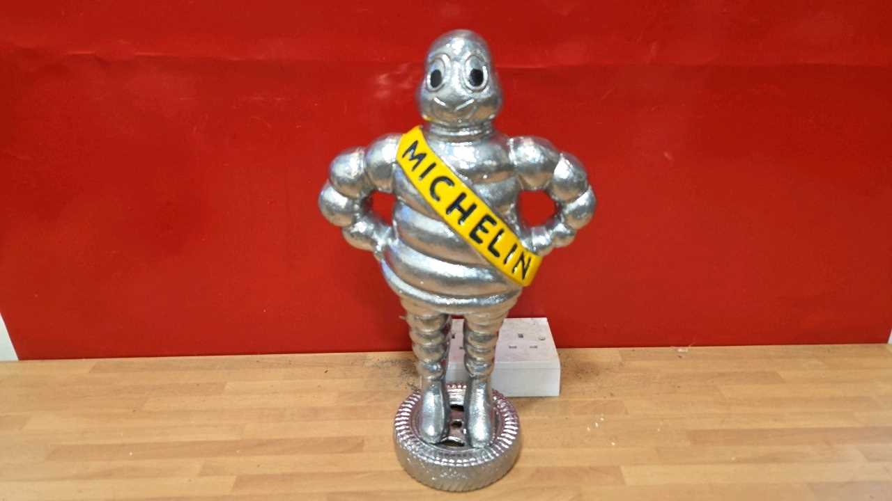 Lot 747 - SILVER MICHELIN MAN 15" TALL