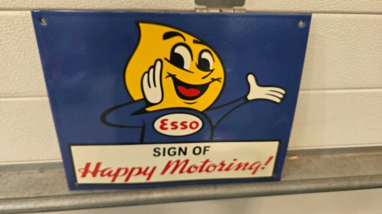 Lot 593 - ESSO HAPPY MOTORING ENAMEL SIGN 13" X 12"
