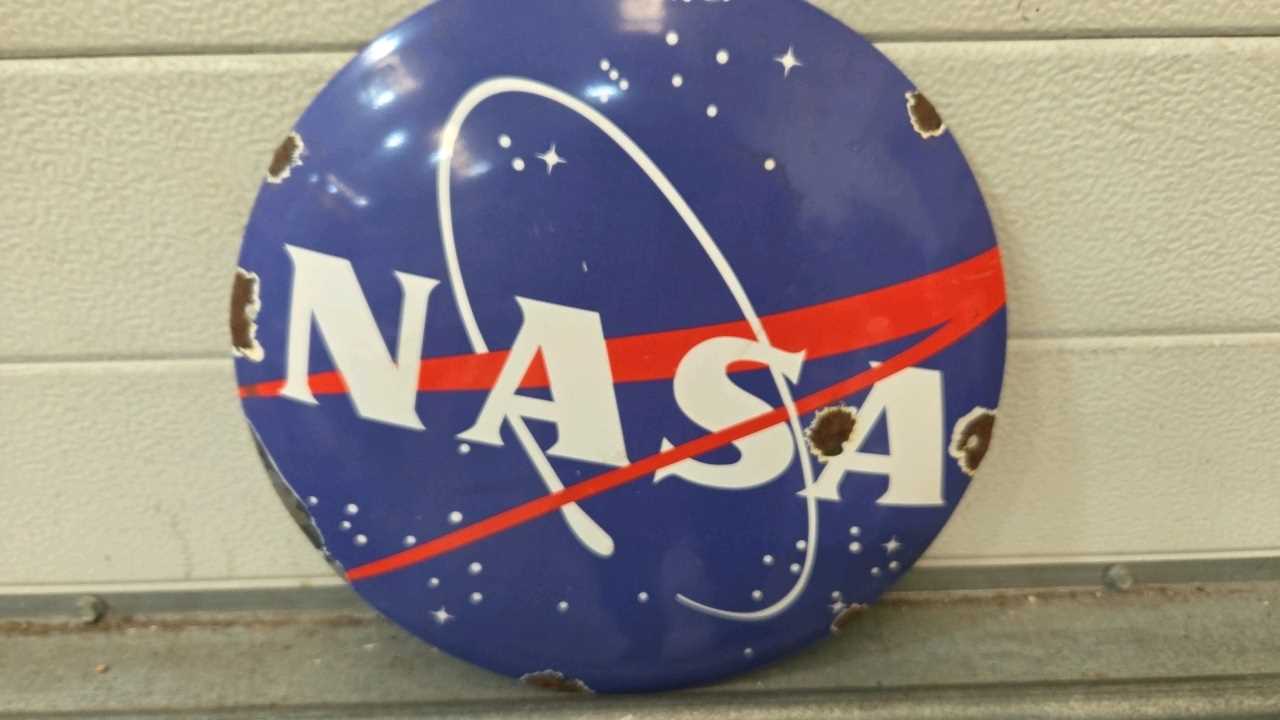 Lot 819 - NASA ENAMEL SIGN 12" DIA