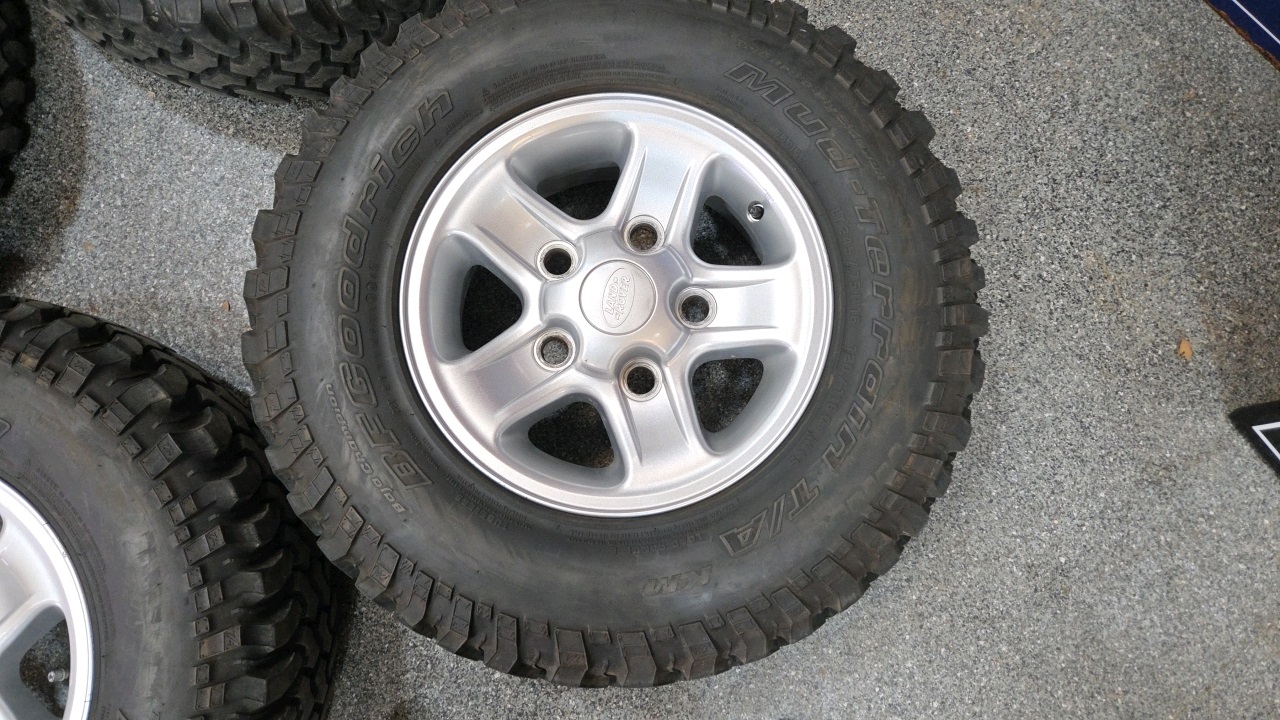 Lot 847 - 4 X LAND ROVER DEFENDER WHEELS C/W MUD