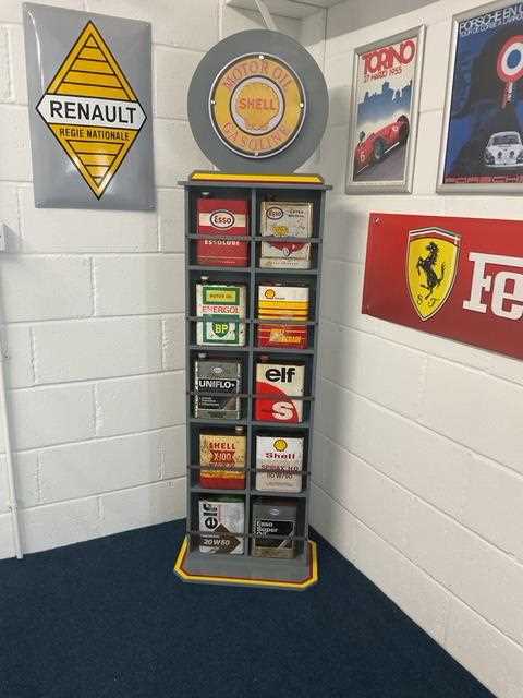 Lot 233 - VINTAGE OIL CANS IN DISPLAY CABINET