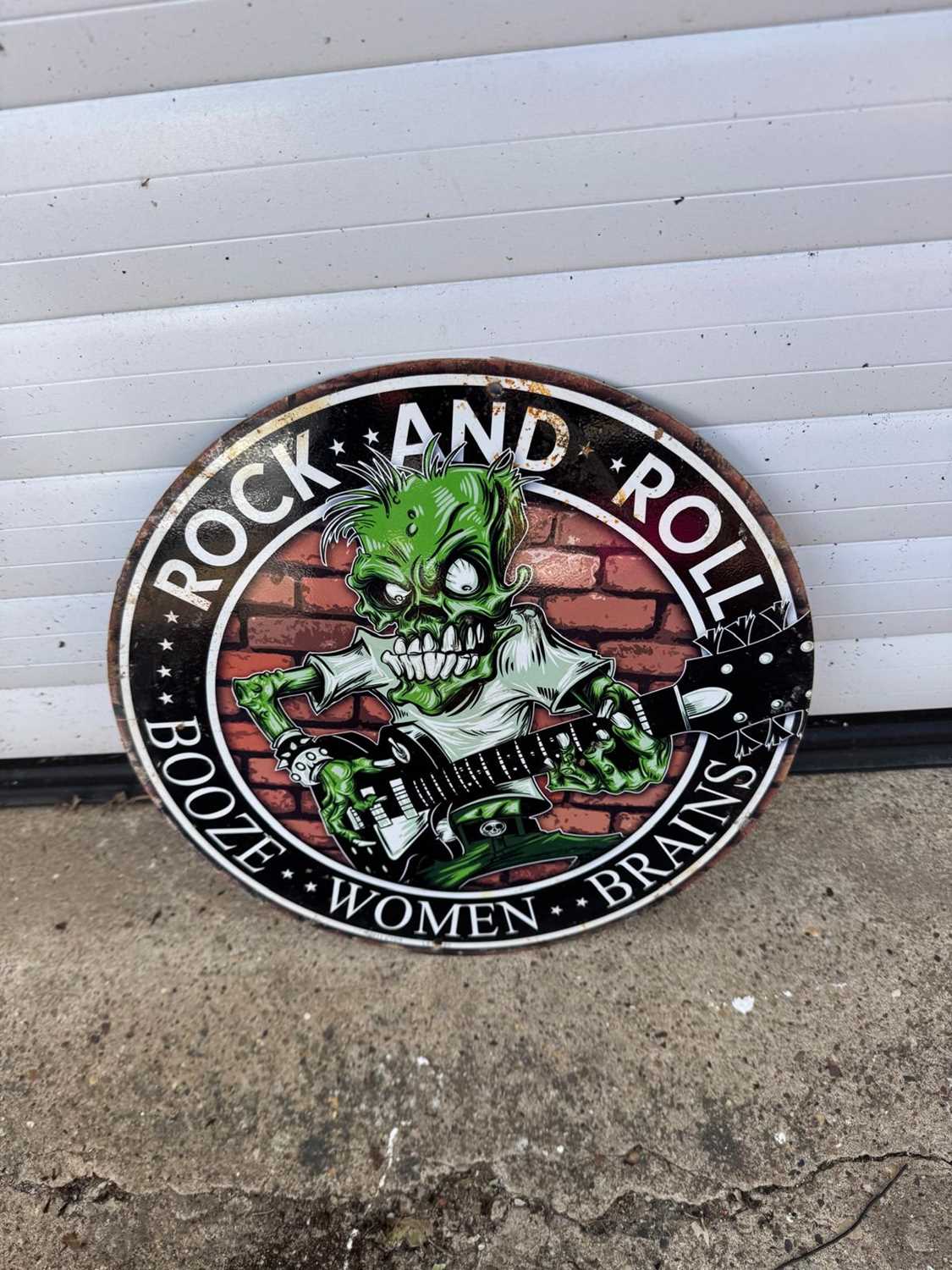 Lot 695 - ROCK AND ROLL SIGN 14" DIA