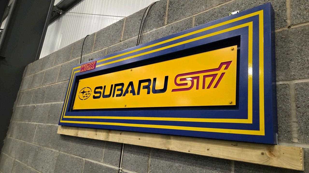 Lot 119 - HAND MADE WOODEN ILLUMINATED SUBARU SIGN 66"