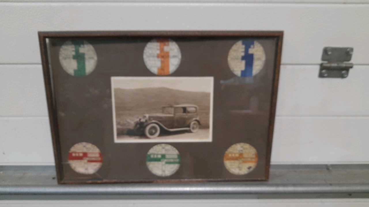 Lot 343 - FRAMED PHOTO WITH TAX DISCS FROM 1929 TO